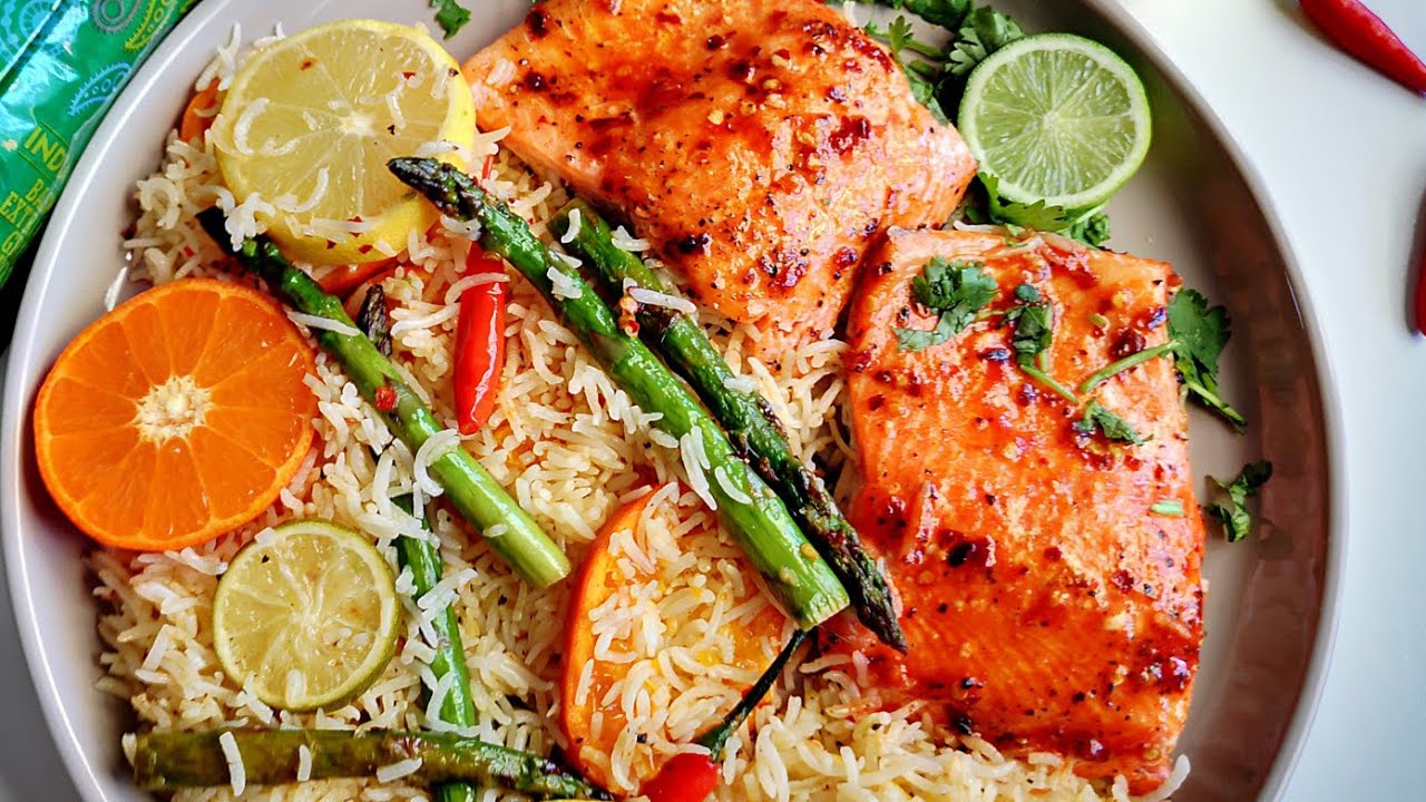 Oven-Baked Rainbow trout fish with delicious asparagus and citrus rice ...
