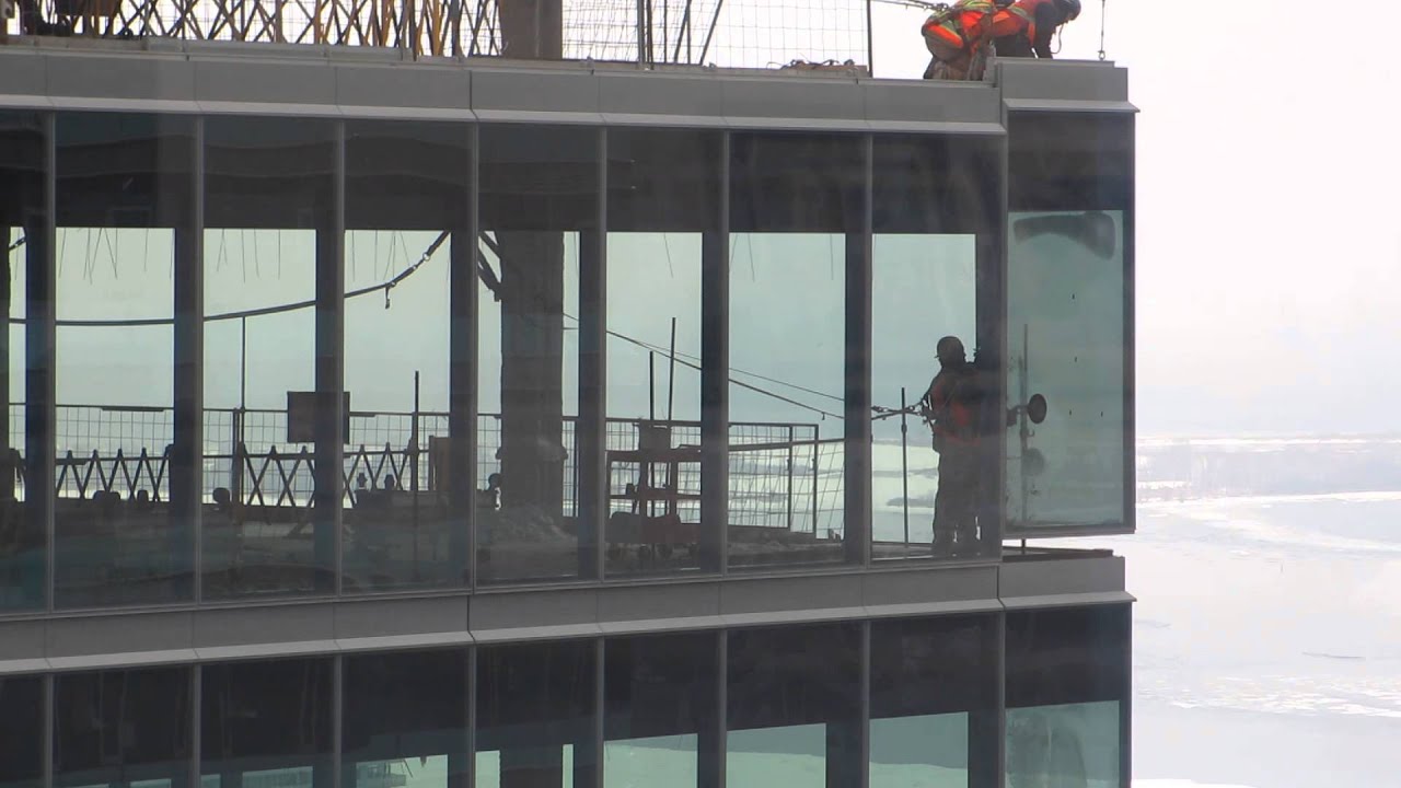 TO High Rise-construction workers installing window on 38th flr Part2 ...