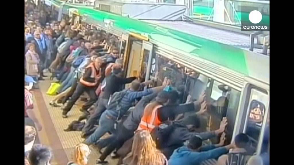 People power: passengers free man trapped by train in Australia - YouTube