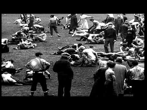 College boys wrestle and tear away each others clothes during a frosh-soph contes...HD Stock Footage