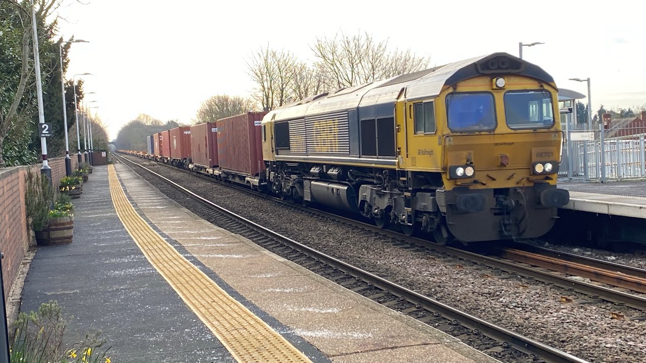 Tango train? 66701 with 6 containers and bright orange Wascosa flatbeds ...