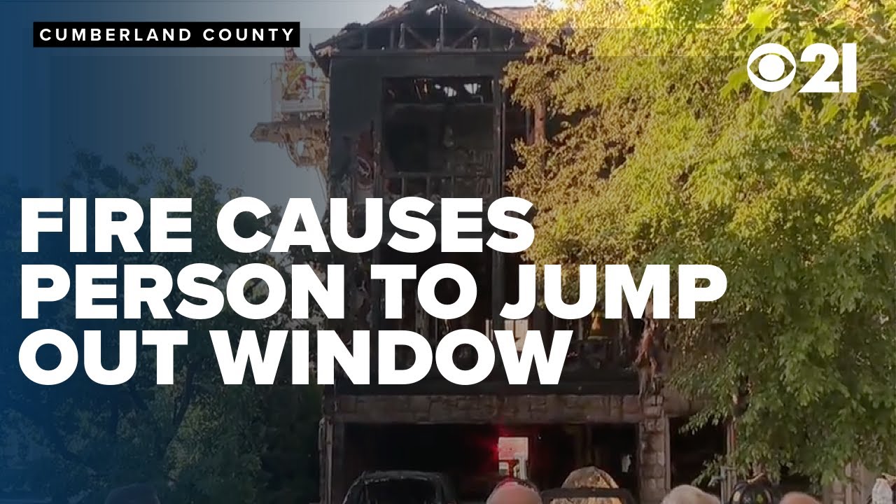 Townhouse catches fire causing resident to jump out window in ...