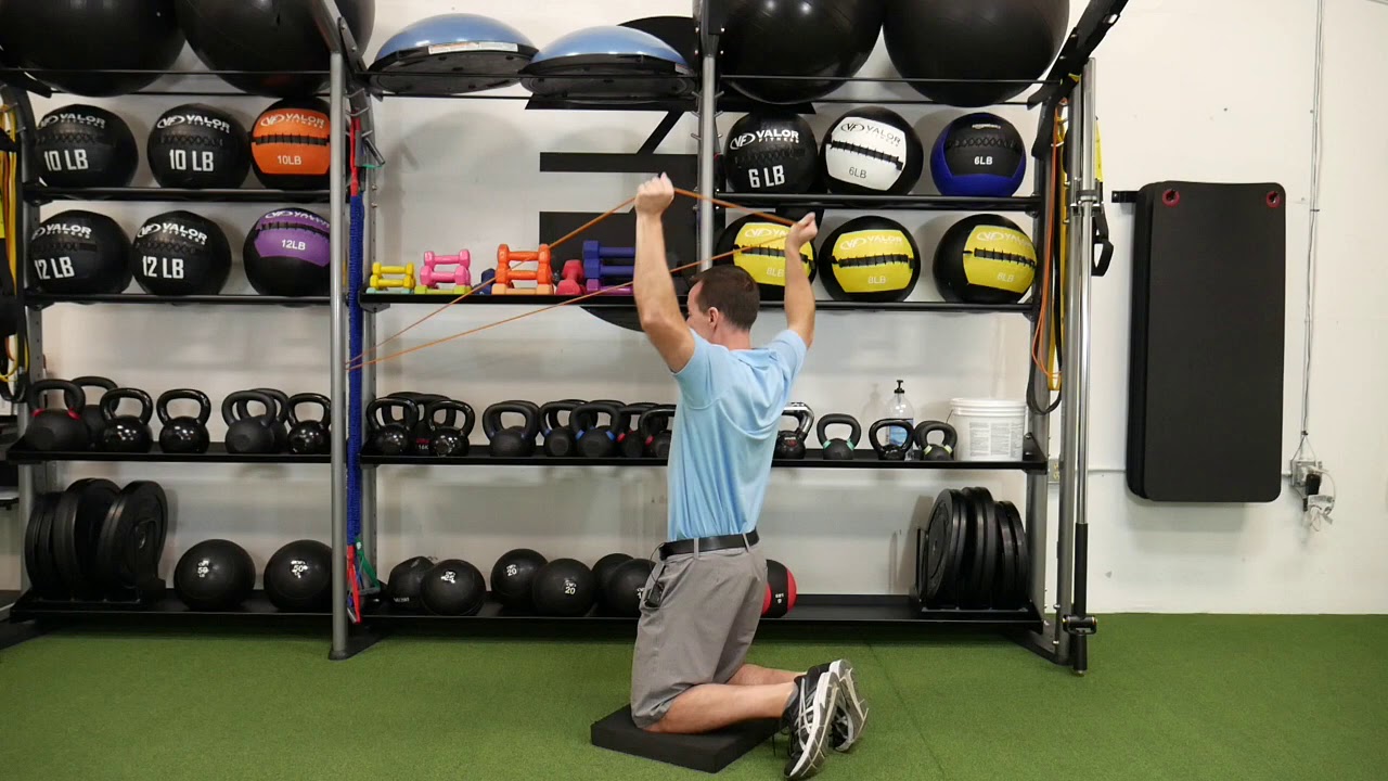 Overhead Press Kneeling Band From Front - YouTube