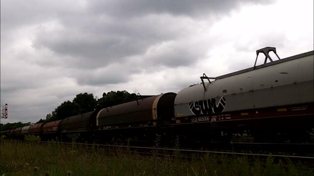 CN 422 w/ CN Engines 3169 & 2541 hooked E.S. lead this long 608 axle, EB Mixed/Autorack train by ...