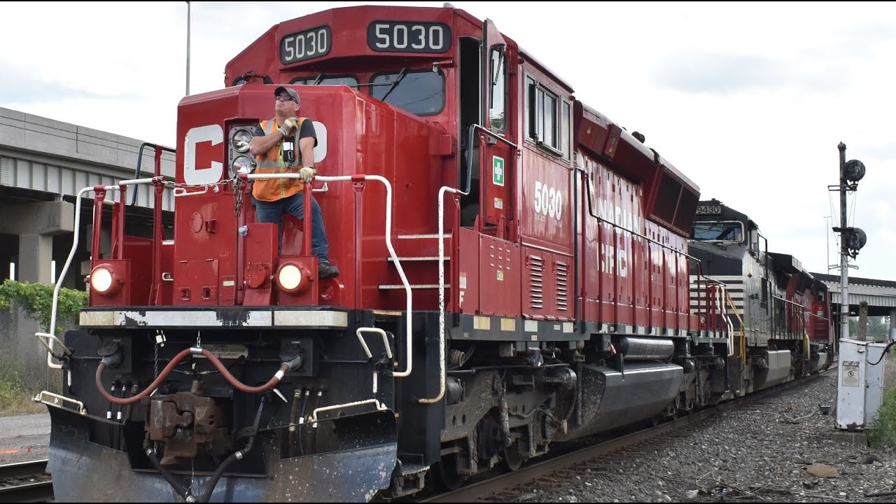 Canadian Pacific Worker on the Front of CP Engine 5030 - Norfolk Southern 9430 - CP 5012 - YouTube