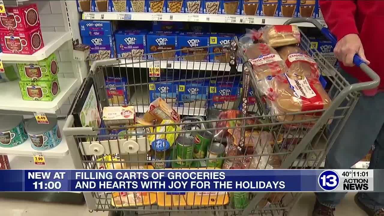 Filling carts of groceries and hearts with joy for the holidays - YouTube