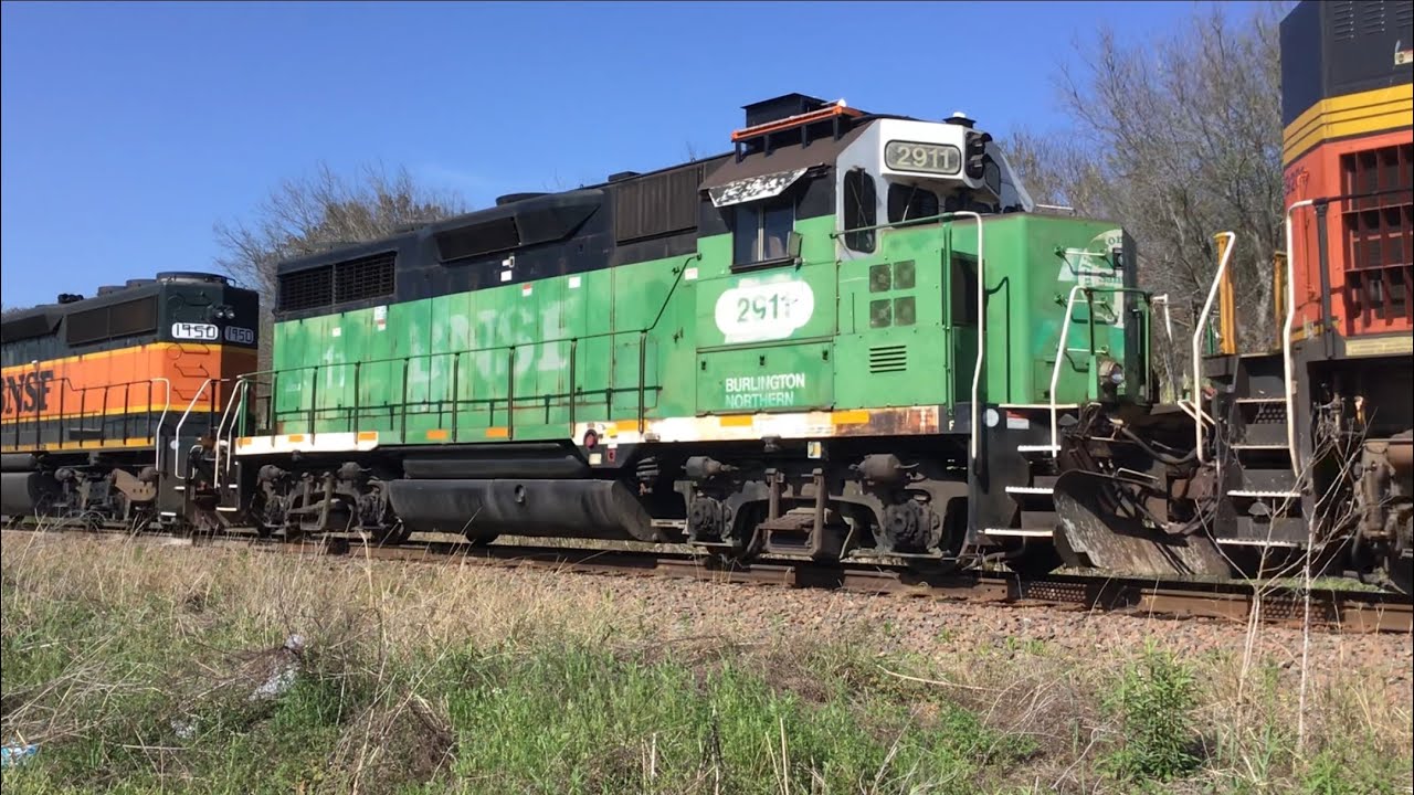 BNSF 5960 ES44AC leads chemical train with BNSF 2911 GP39E and BNSF ...