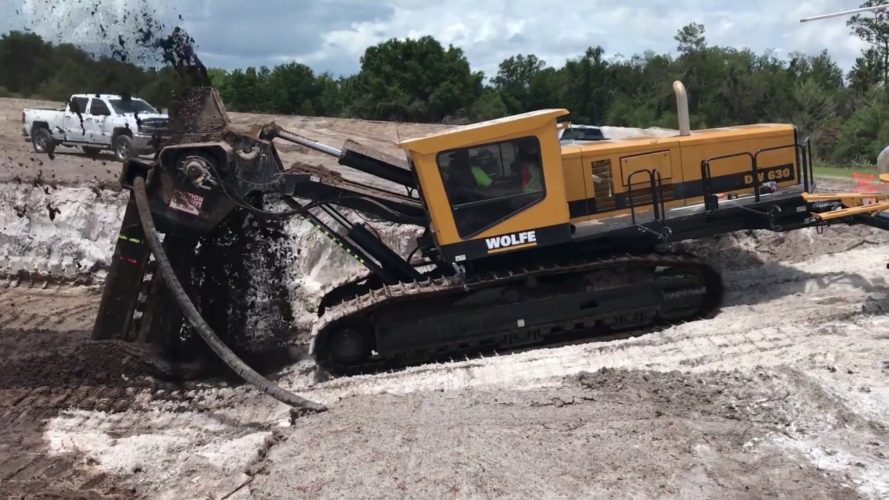 Wolfe DWT630 Dewatering Trencher Pipe Installation - YouTube