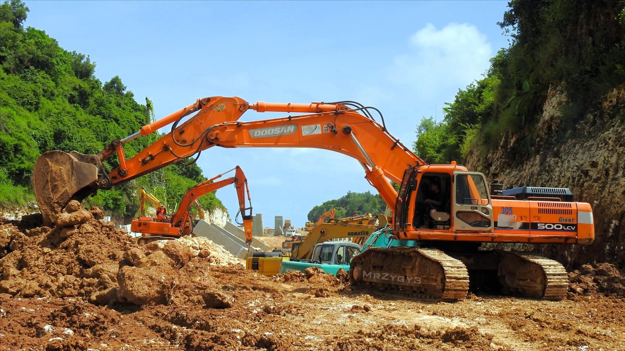 Busy Excavator Trucks Digging Excavating Limestone Dirt From The Dock ...