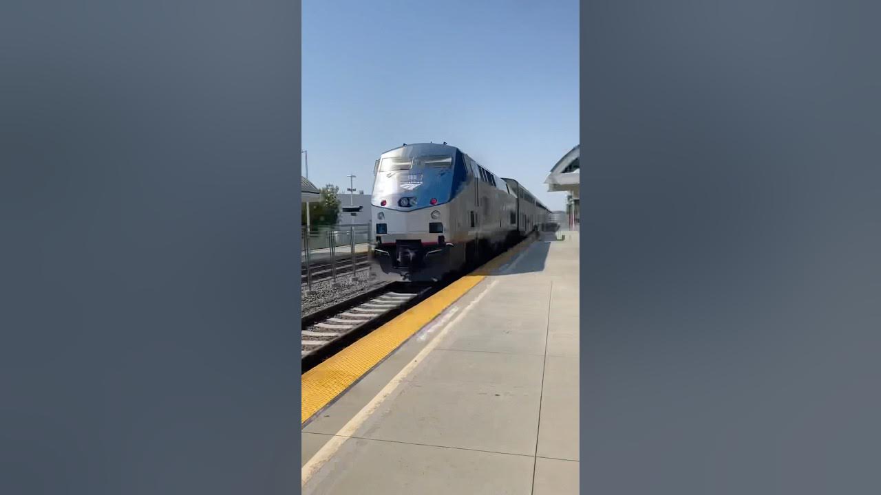 Amtrak Surfliner 777 flies through Tustin 90 mph. With Cab car 6952 leading against P42DC 148 ...