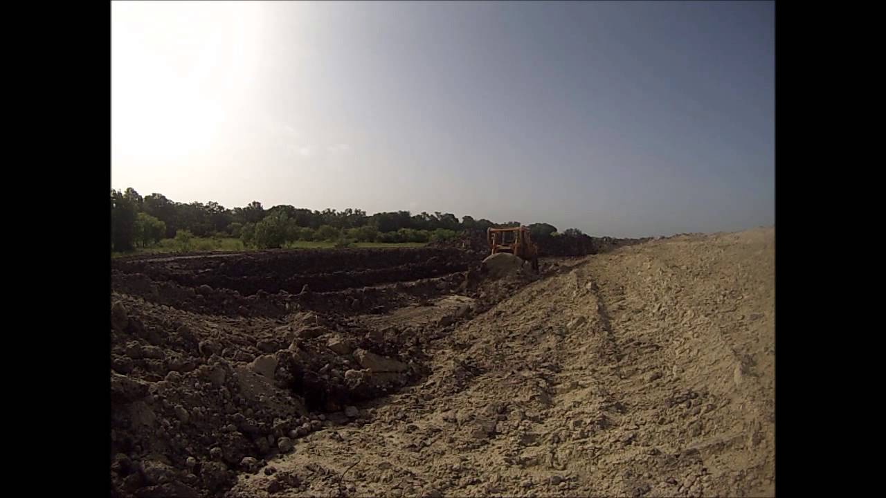 Cat D6R dozer: pushing reserve pit - YouTube