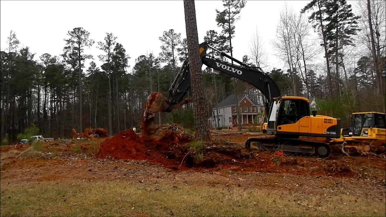 Volvo Ec160 Pushing over Pines - YouTube