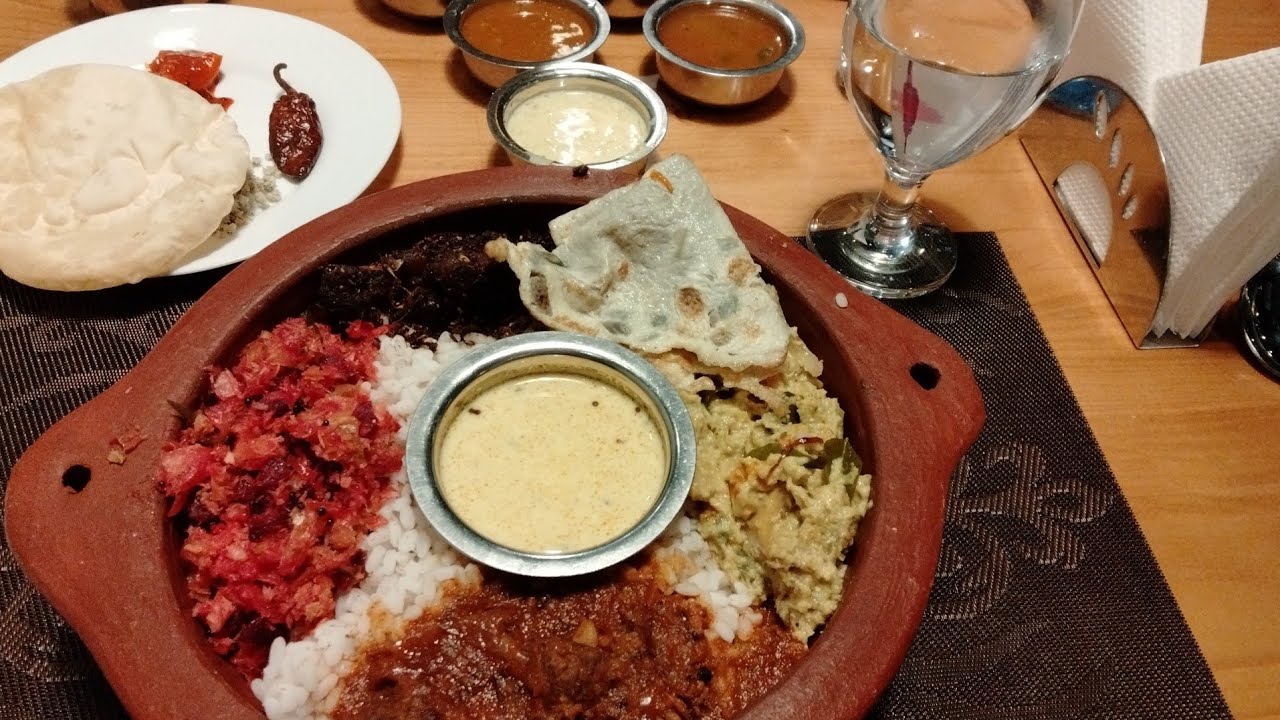 Traditional chatti choru and pothichoru at Kairali gardens restaurant ...