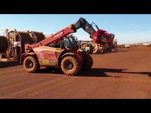 Manitou Belt Reel Shaft Handler - Mining attachment - YouTube