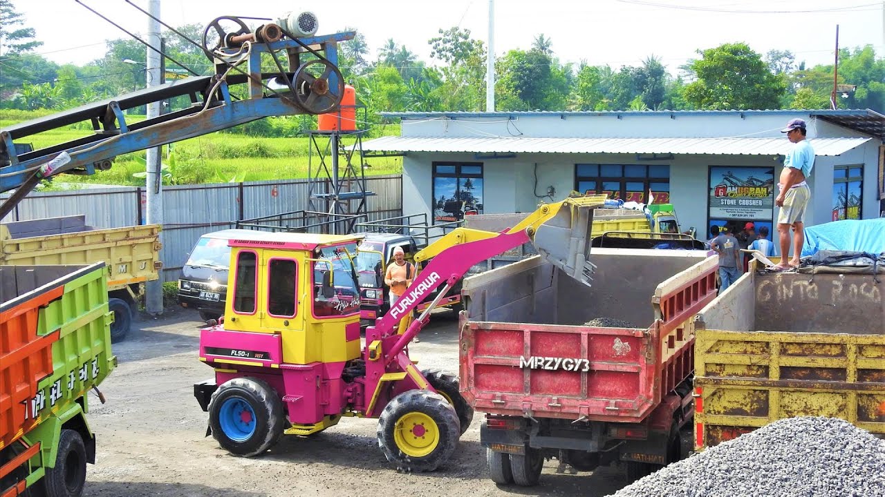 Trucks Wheel Loader Loading Aggregate On The Stone Crusher Plant - YouTube