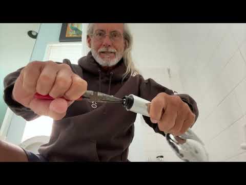 How to remove a water restrictor from a shower head