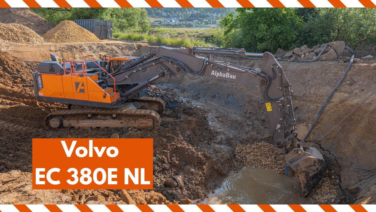 Mighty Volvo EC 380E with a two piece boom working on a water retention ...
