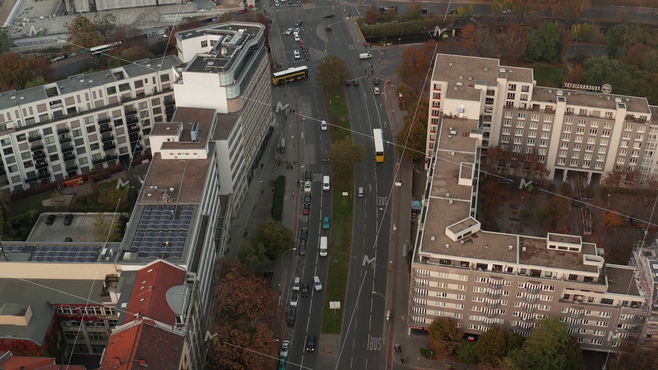 AERIAL: View of typical german street traffic with Bus public ...