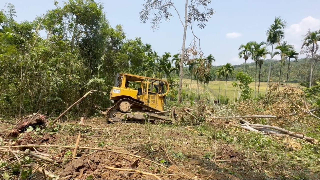 EXCELLENT SKILLS OF BULLDOZER OPERATORS PUSHING OVERFLOW FOR NEW ROADS ...