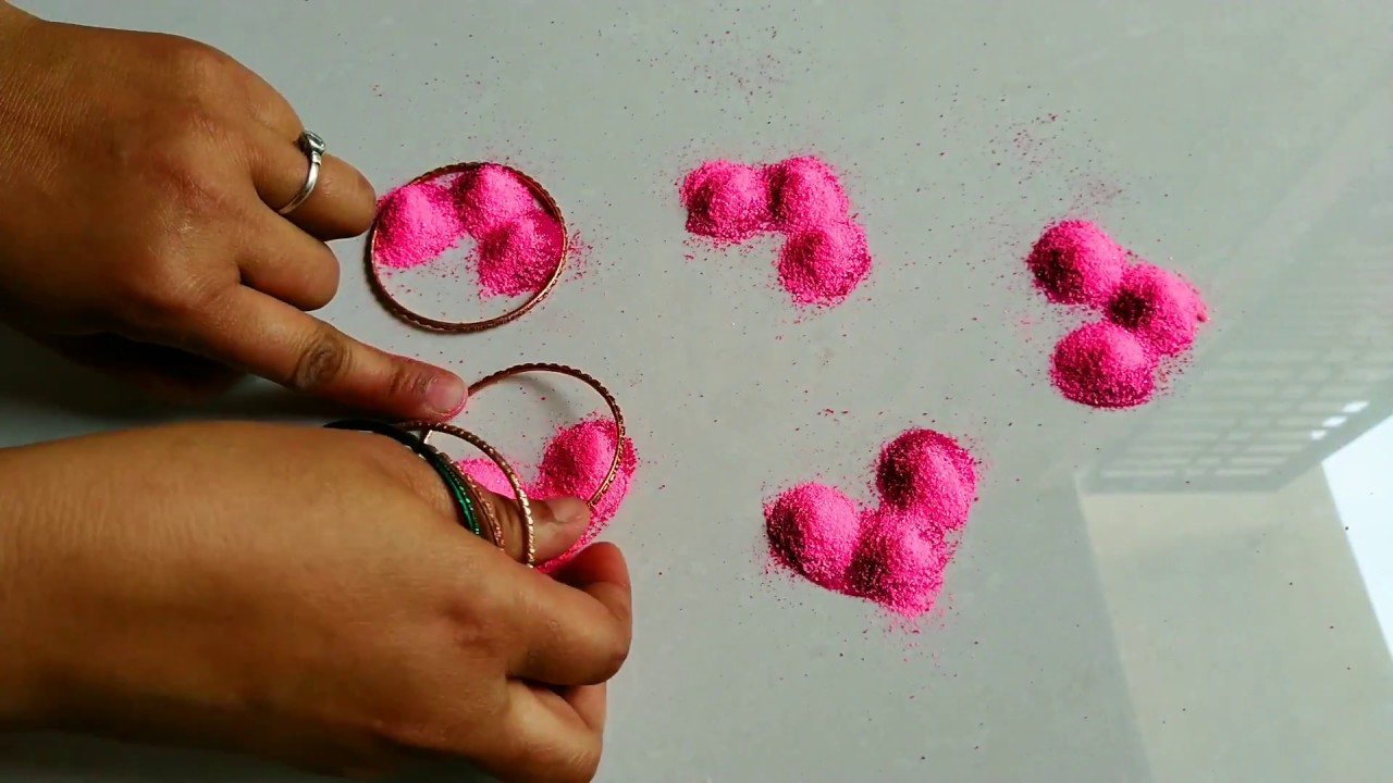 Beautiful freehand flowers rangoli design by easy rangoli classes - YouTube