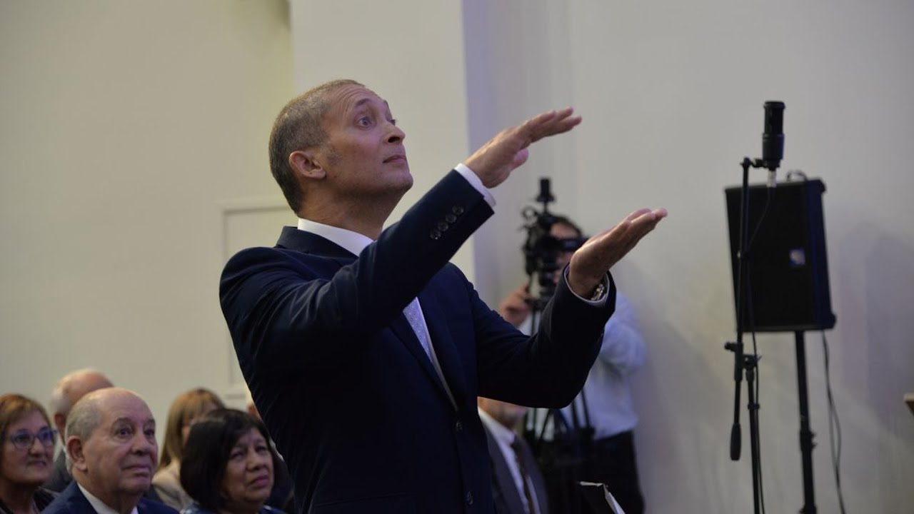 District Apostle Lambert conducting a choir in Montevideo, South ...