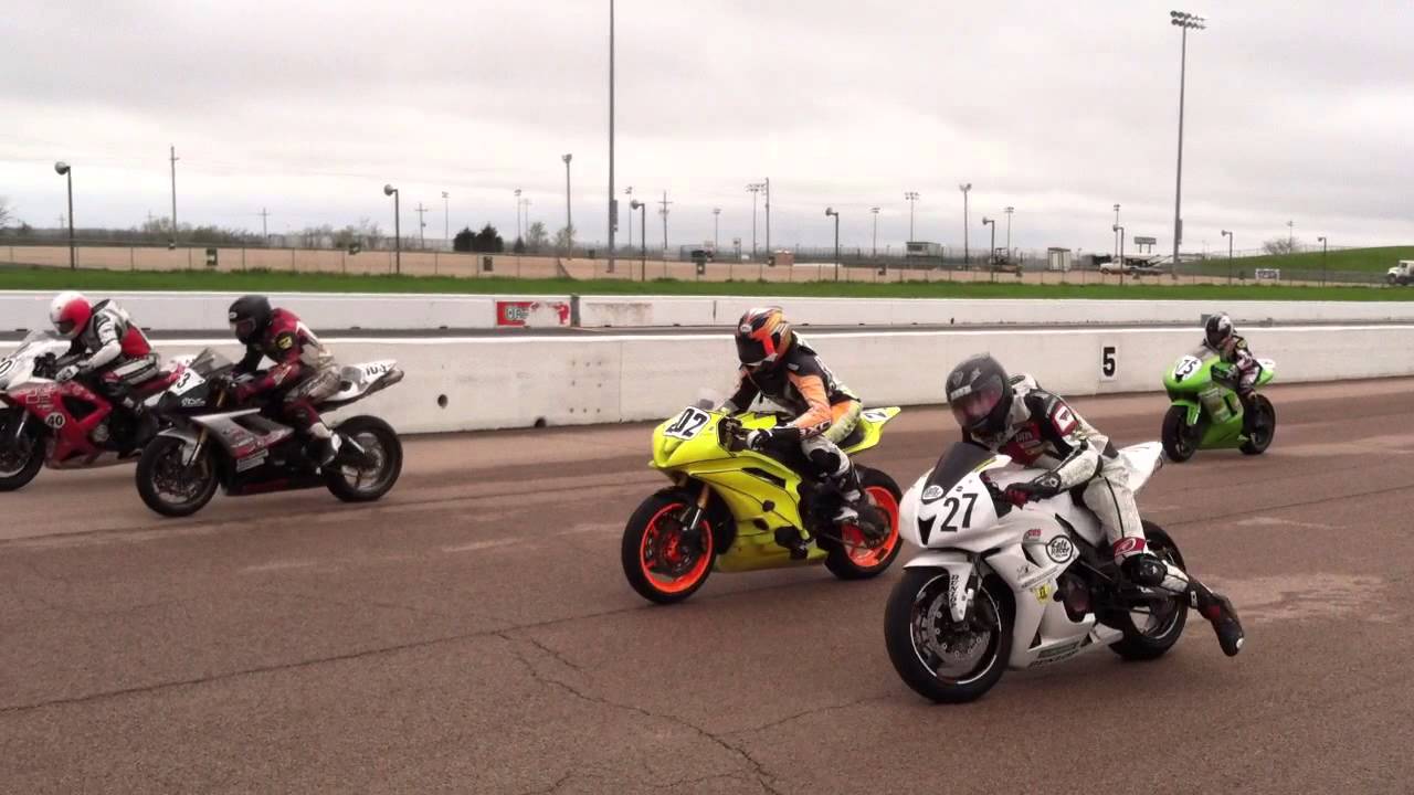 Motorcycle racers on the starting grid for CCS race at Heartland Park ...