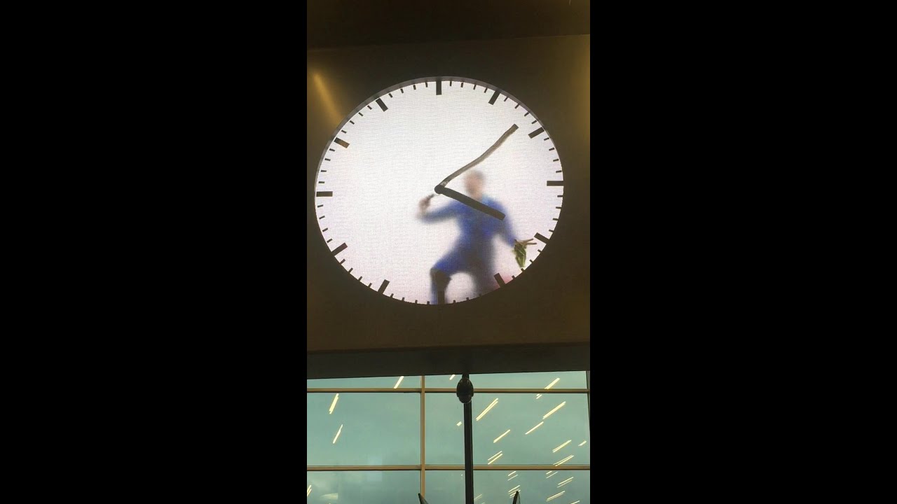 Man in a clock. Amsterdam, Schiphol Airport. - YouTube