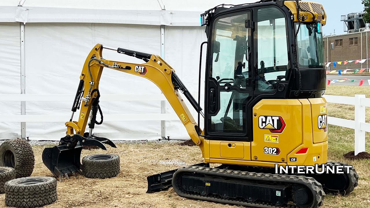 Remote controlled CAT 302 compact excavator demonstration - YouTube