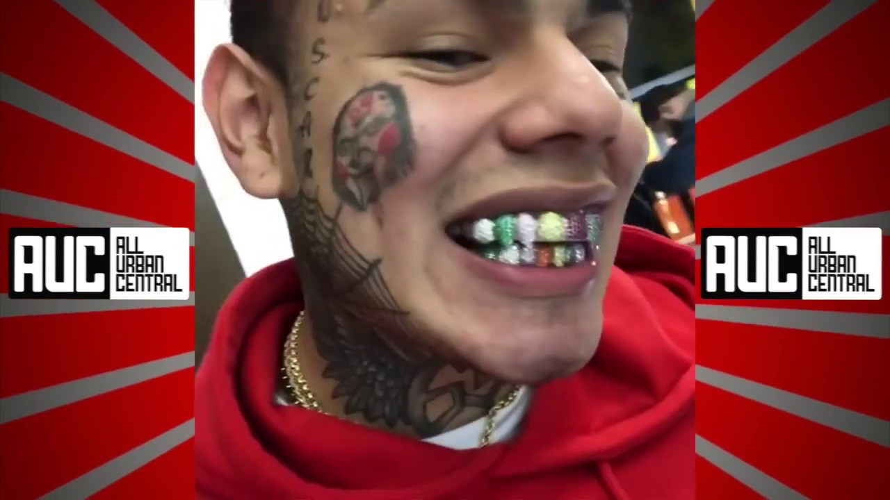 6ix9ine Spends $150K On Rainbow Diamond Teeth With Fangs - YouTube
