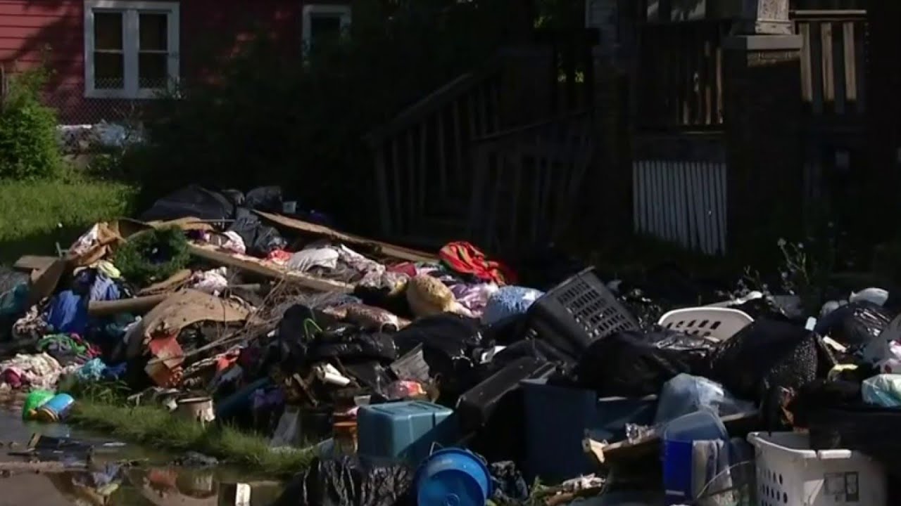 City of Detroit cleans up pile of trash from June flooding - YouTube