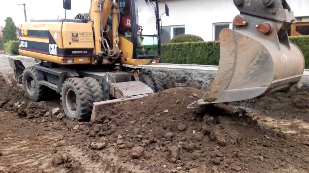 CATERPILLAR M318 - YouTube