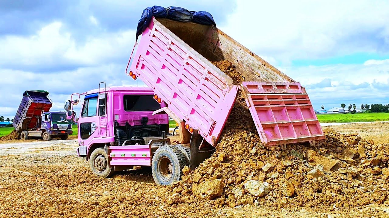Dump Truck Working, UD Dump Truck, Bulldozer operator skill pushing ...