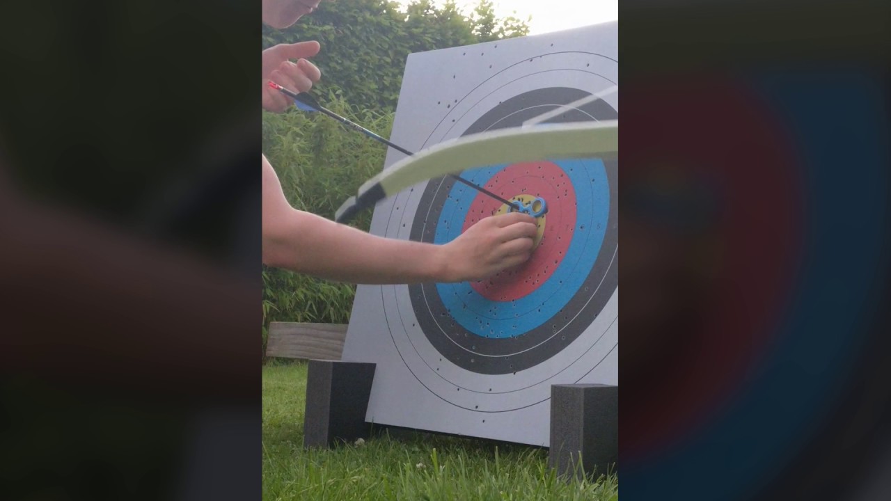 Nailing an arrow in a spinning fidget spinner - YouTube