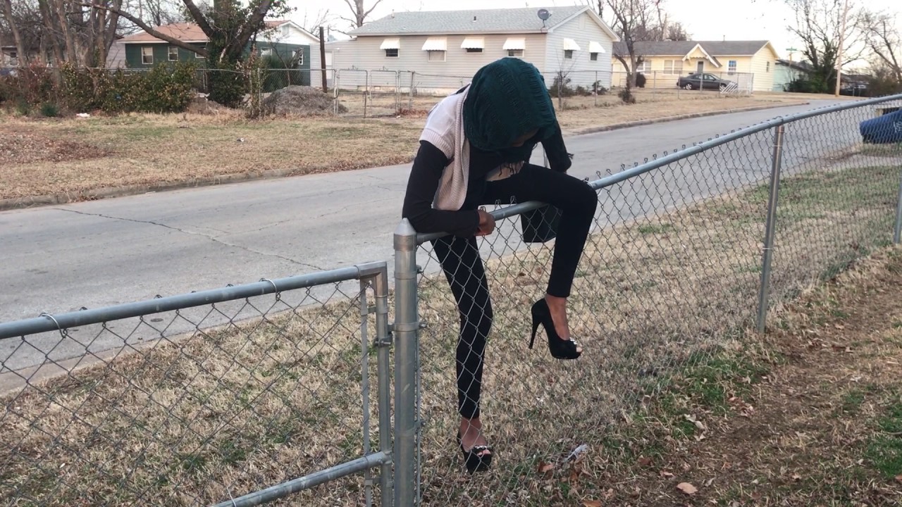 Climbing a fence in 5 inch heels - YouTube