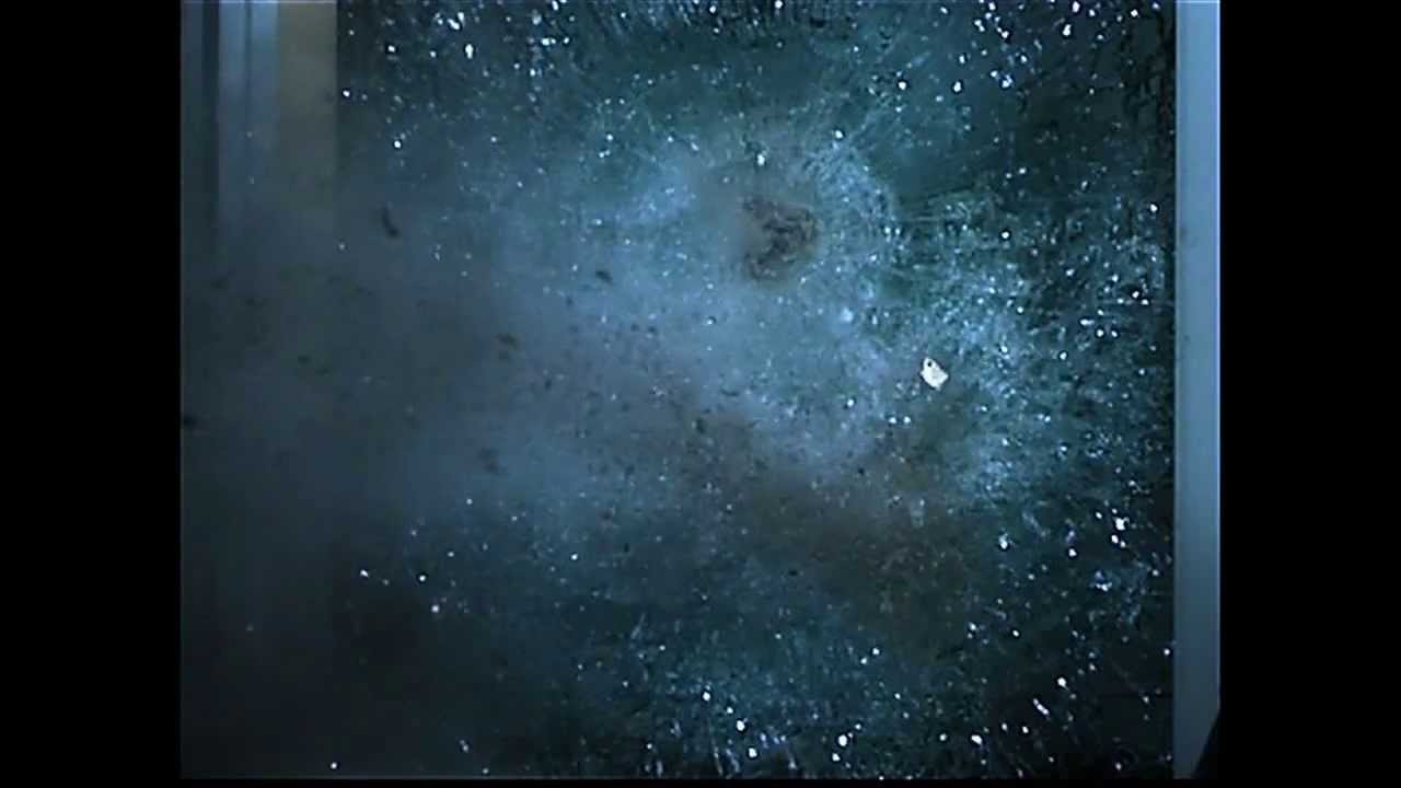 Slow motion video of a bullet hitting bulletproof glass - YouTube