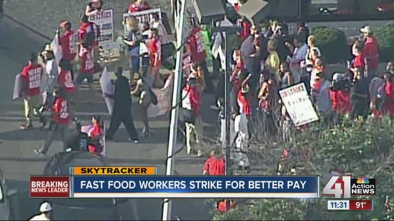 Fast food workers strike for better pay - YouTube