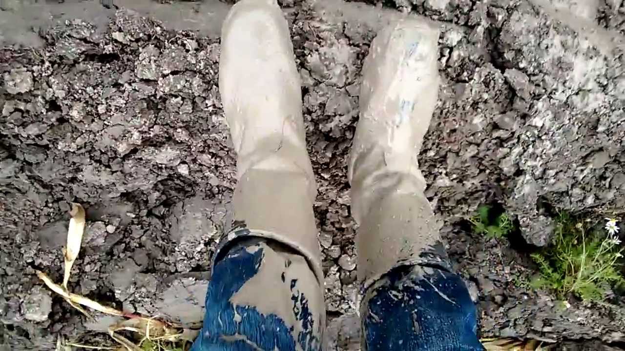 Boots splashing in muddy puddle - YouTube