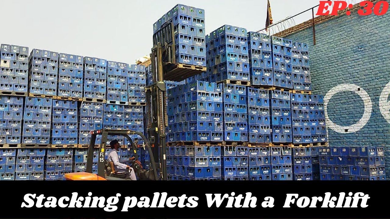 Forklift Operator Stacking Empty Pepsi Pallets On Top Of Each Other ...