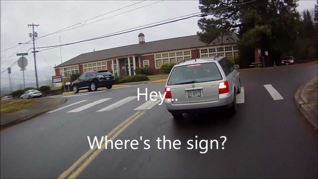 Driver crushed stop sign outside school 2011-12-29 - YouTube
