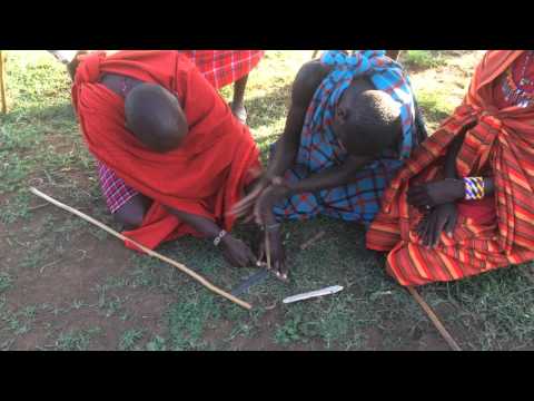 Maasai men making a fire