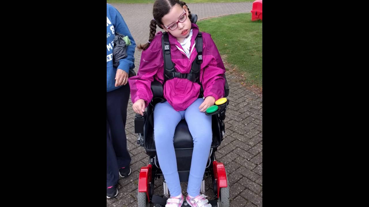 Emily learning her new power chair. - YouTube