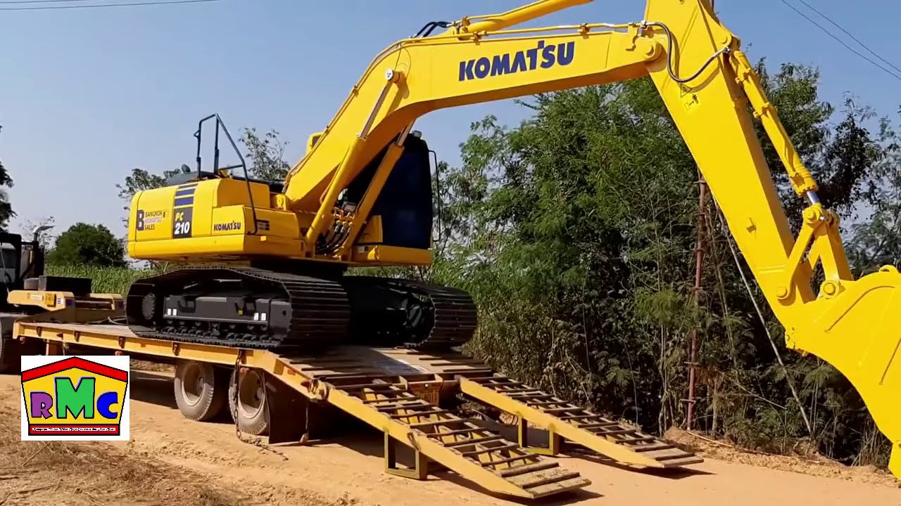 menurunkan bego excavator dari truk - YouTube
