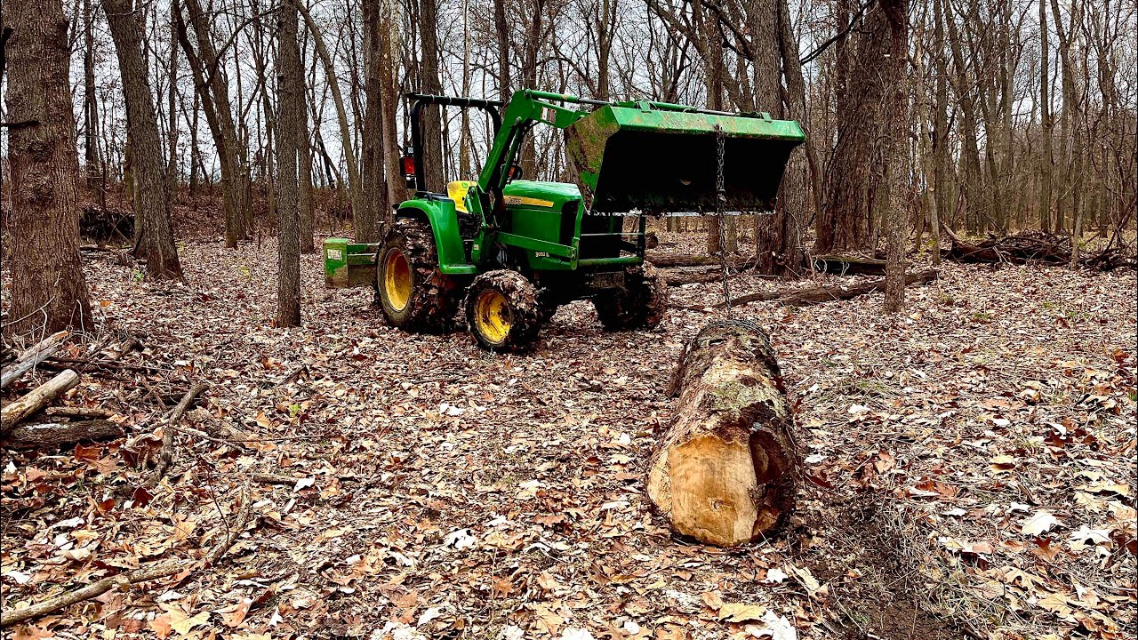 Pulling Logs out of the Creek - YouTube