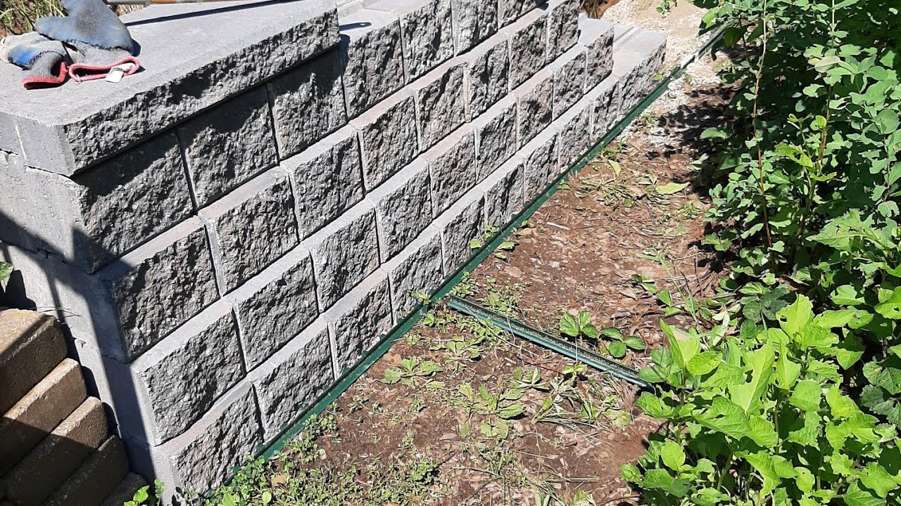 Step by step building a retaining wall - YouTube