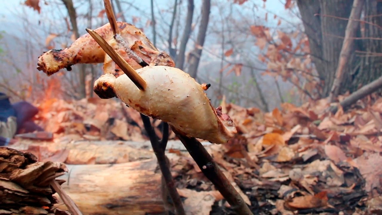 Bushcraft cooking: chicken on a stick - YouTube