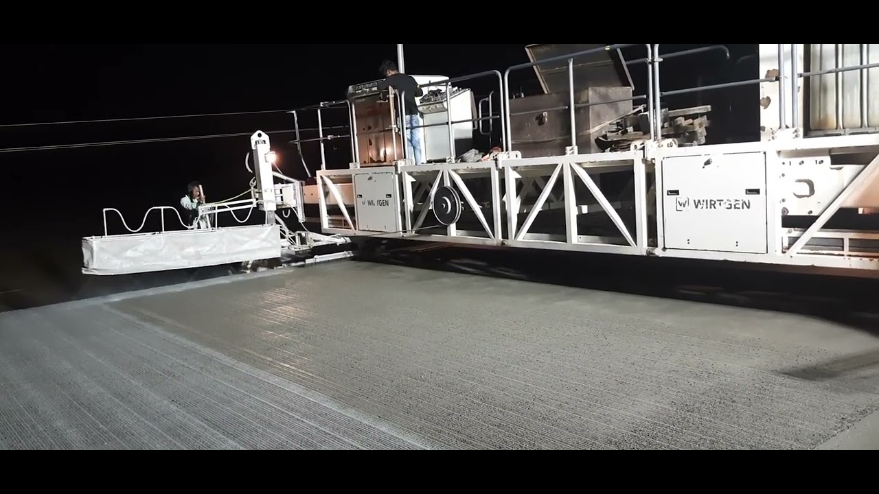 texturing work by T.C.M. going on after pqc laying by paver sp 94 ...