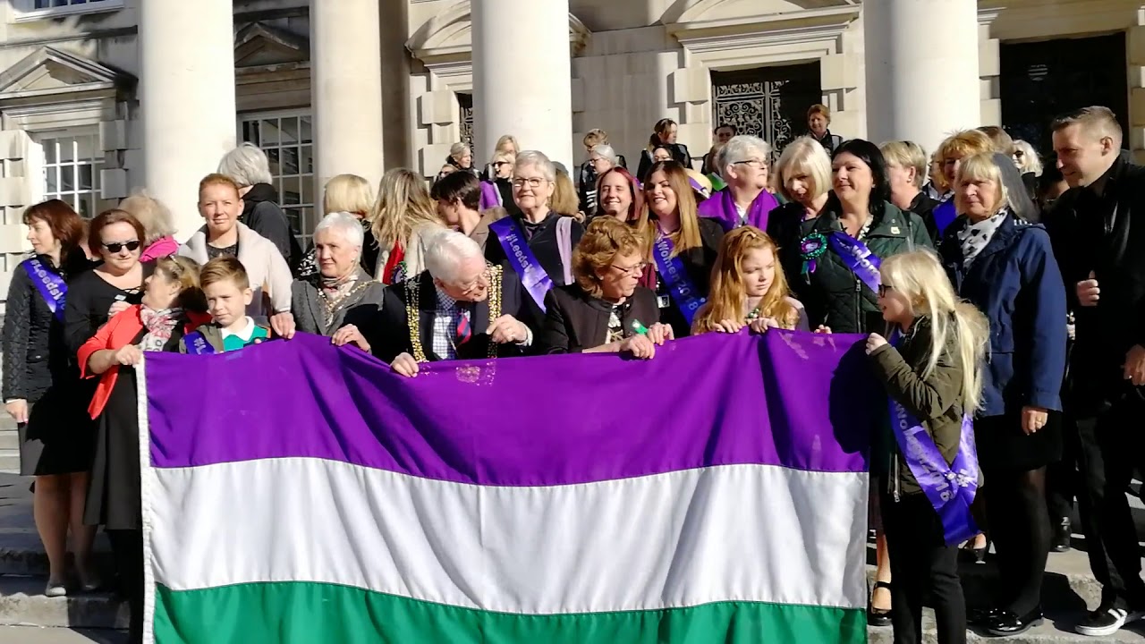 Sufferage flag welcomed in Leeds - YouTube