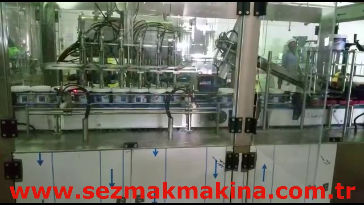 bucket filling and cover closing machine - YouTube