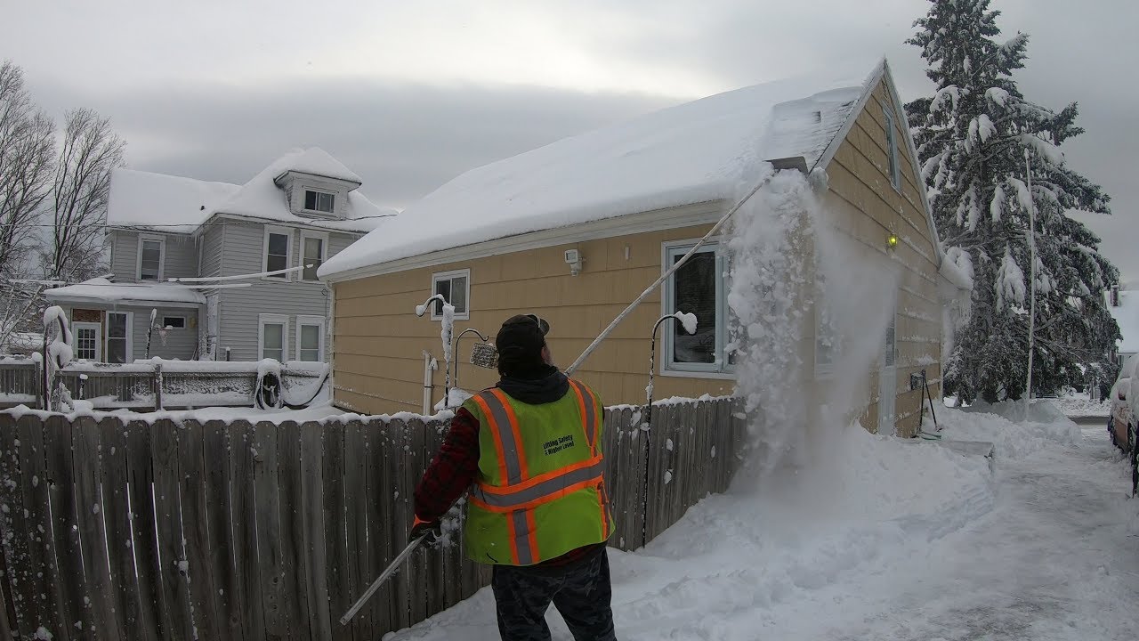 Snow Removal From The Roof Of A House Stopping Ice Dams (Time Lapse ...