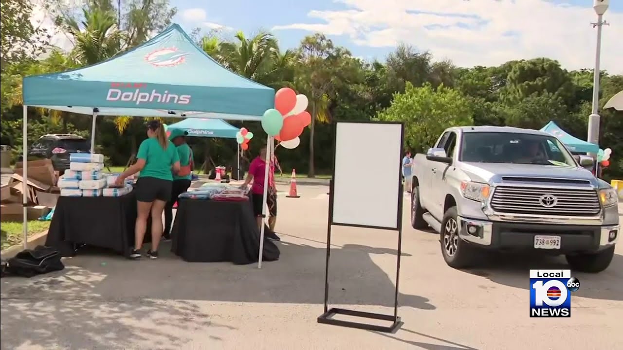 Dolphins hold drive-thru baby shower for veteran mothers - YouTube